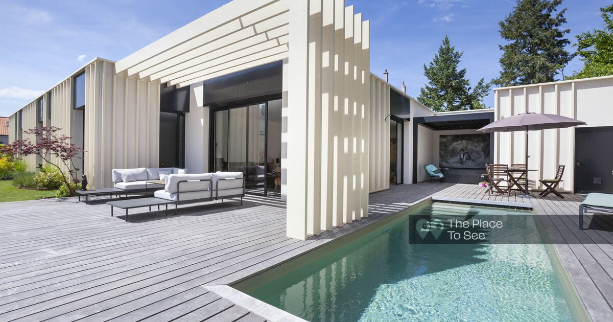 Contemporary house with atypical metal architecture and swimming pool