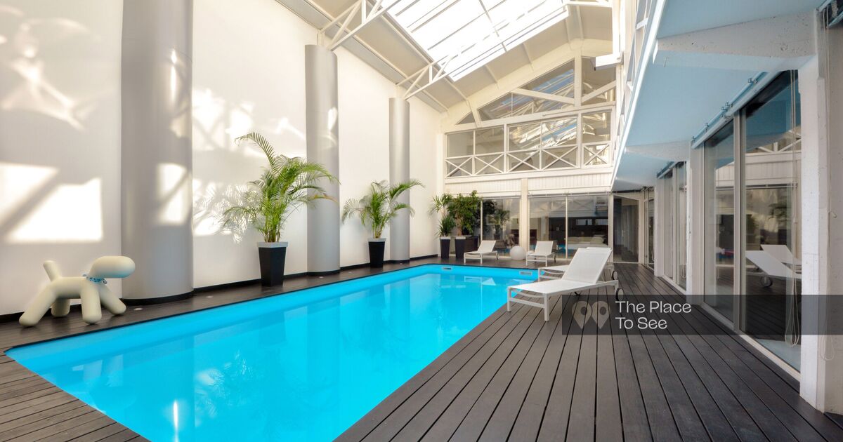White loft with large indoor swimming pool under glass roof | The place ...